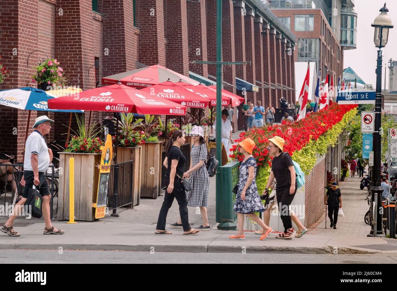 Toronto, Canada - 08 03 2018: People at the corner of Front Street and ...