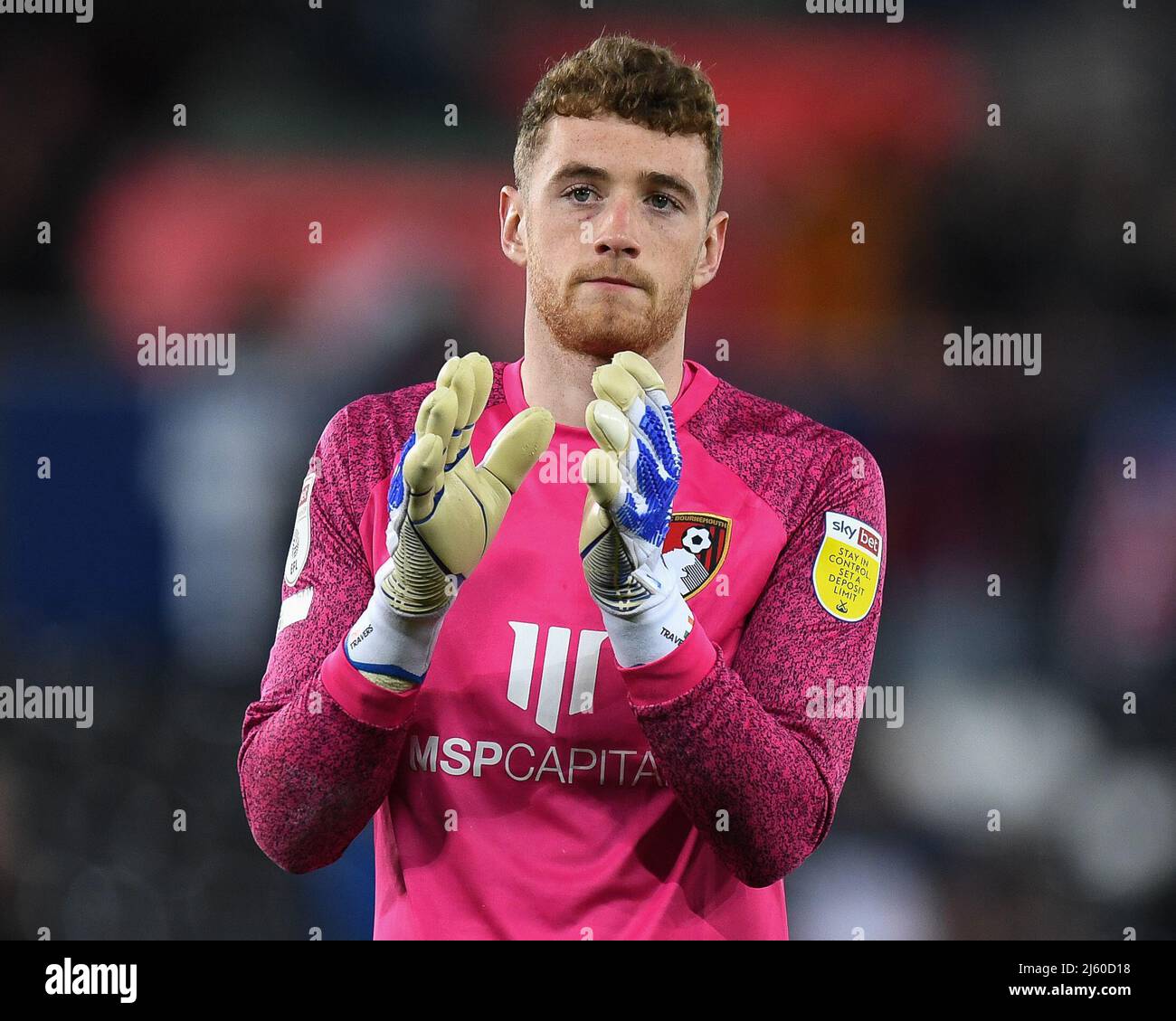 Mark Travers #42 of Bournemouth applauds the travelling supporters ...