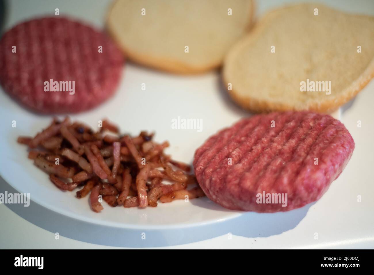 Fresh meat, beef, with seed bun and knife Stock Photo - Alamy