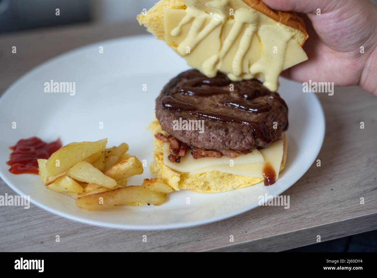 Handmade hamburger with french fries and dips made at home Stock Photo ...