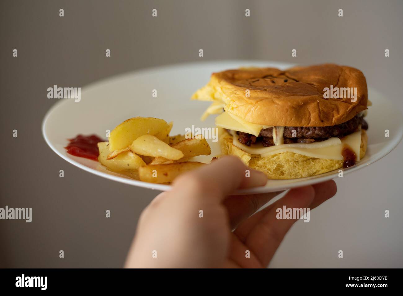Handmade hamburger with french fries and dips made at home Stock Photo ...