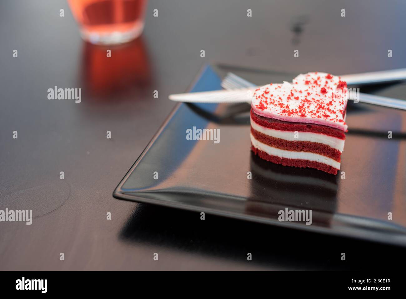 Red Velvet cake with tea and coffee in an urban coffee shop terrace ...