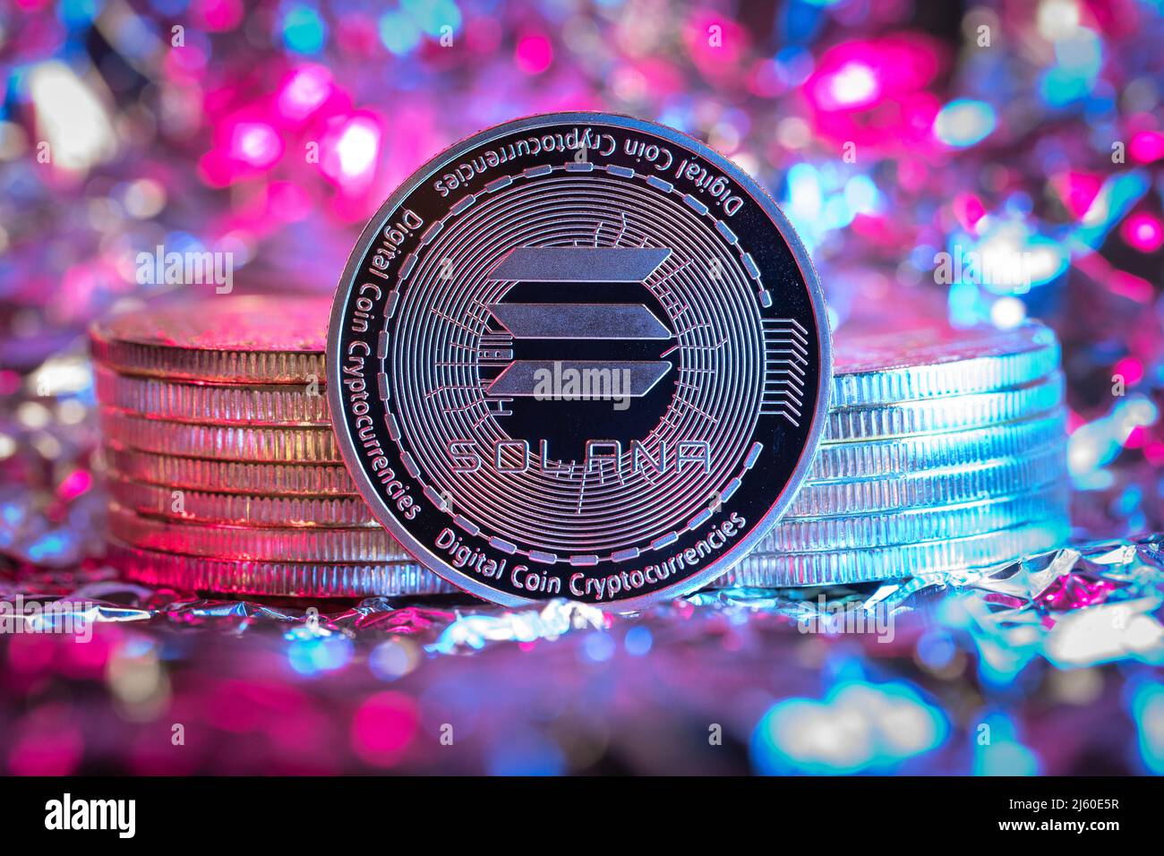 Solana SOL cryptocurrency physical coin, abstract background Stock ...