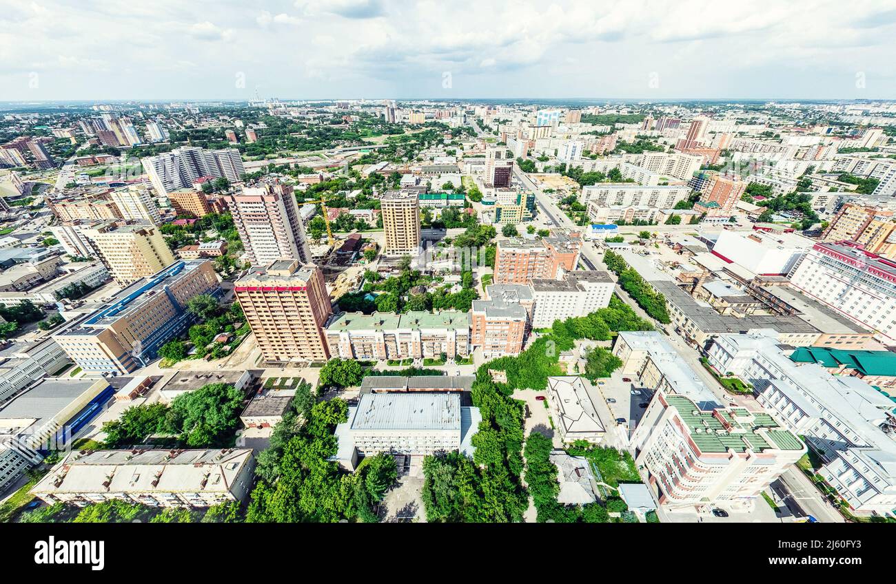 Aerial city view with crossroads and roads, houses, buildings, parks ...