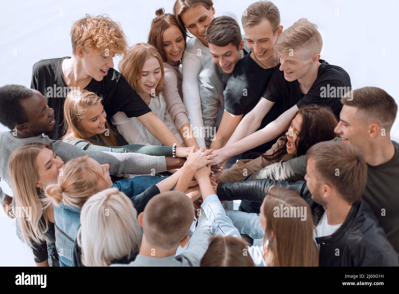 group of diverse people joining their hands in a circle Stock Photo - Alamy
