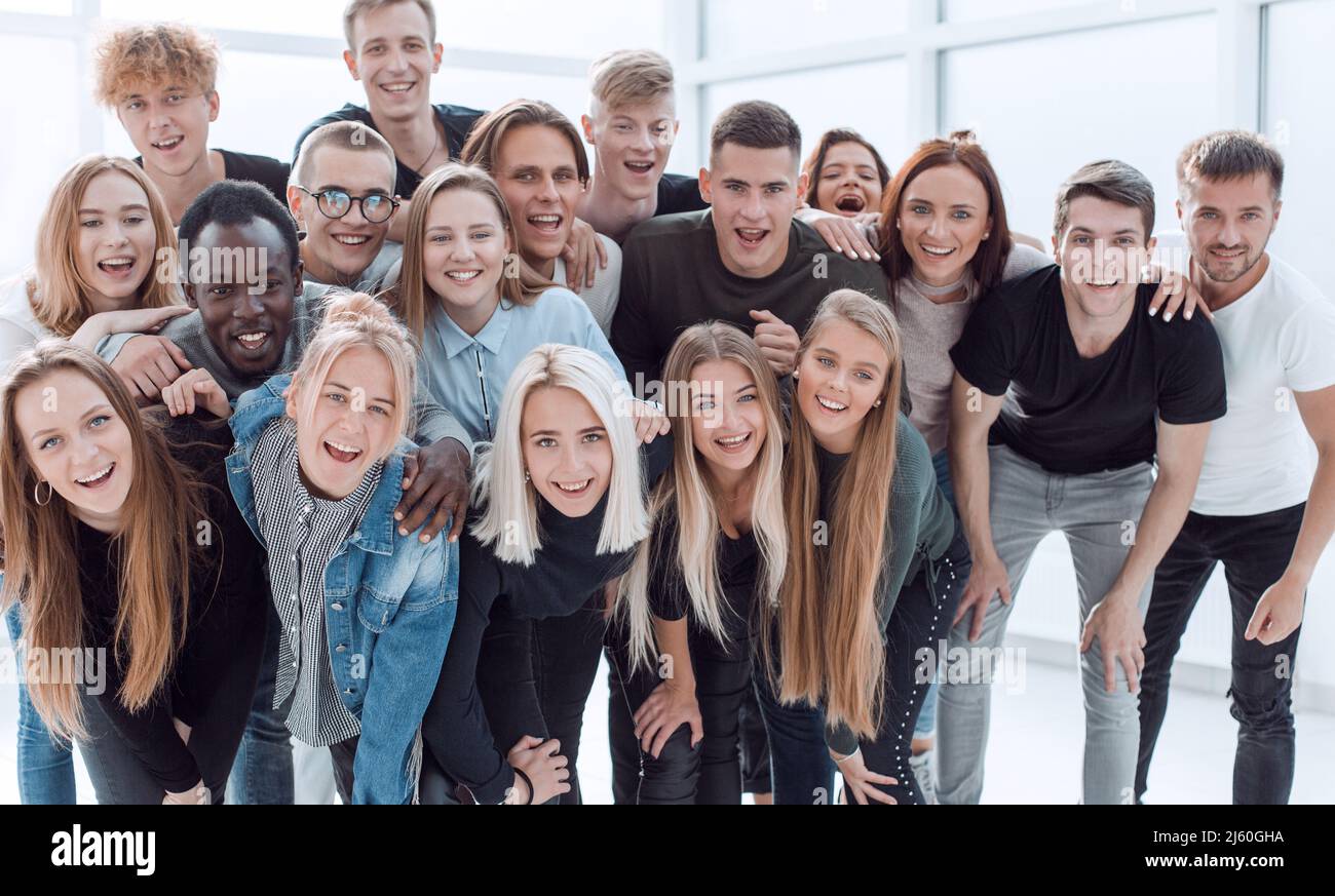 in full growth. happy young people standing together Stock Photo - Alamy