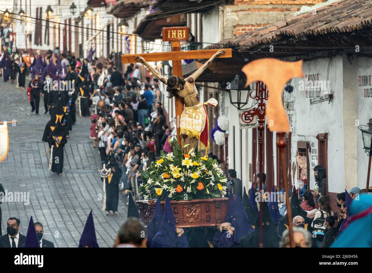 Roman Catholic hooded penitents wearing traditional capirotes, carry a ...