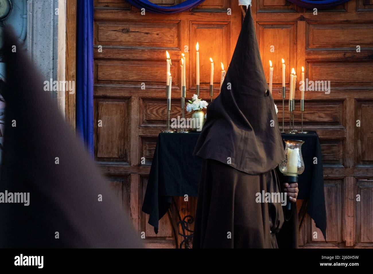 Roman Catholic hooded penitents wearing traditional capirotes, during ...