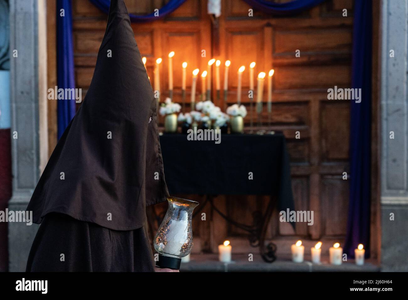 Roman Catholic hooded penitents wearing traditional capirotes, during ...