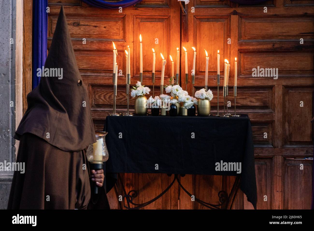 Roman Catholic hooded penitents wearing traditional capirotes, during ...