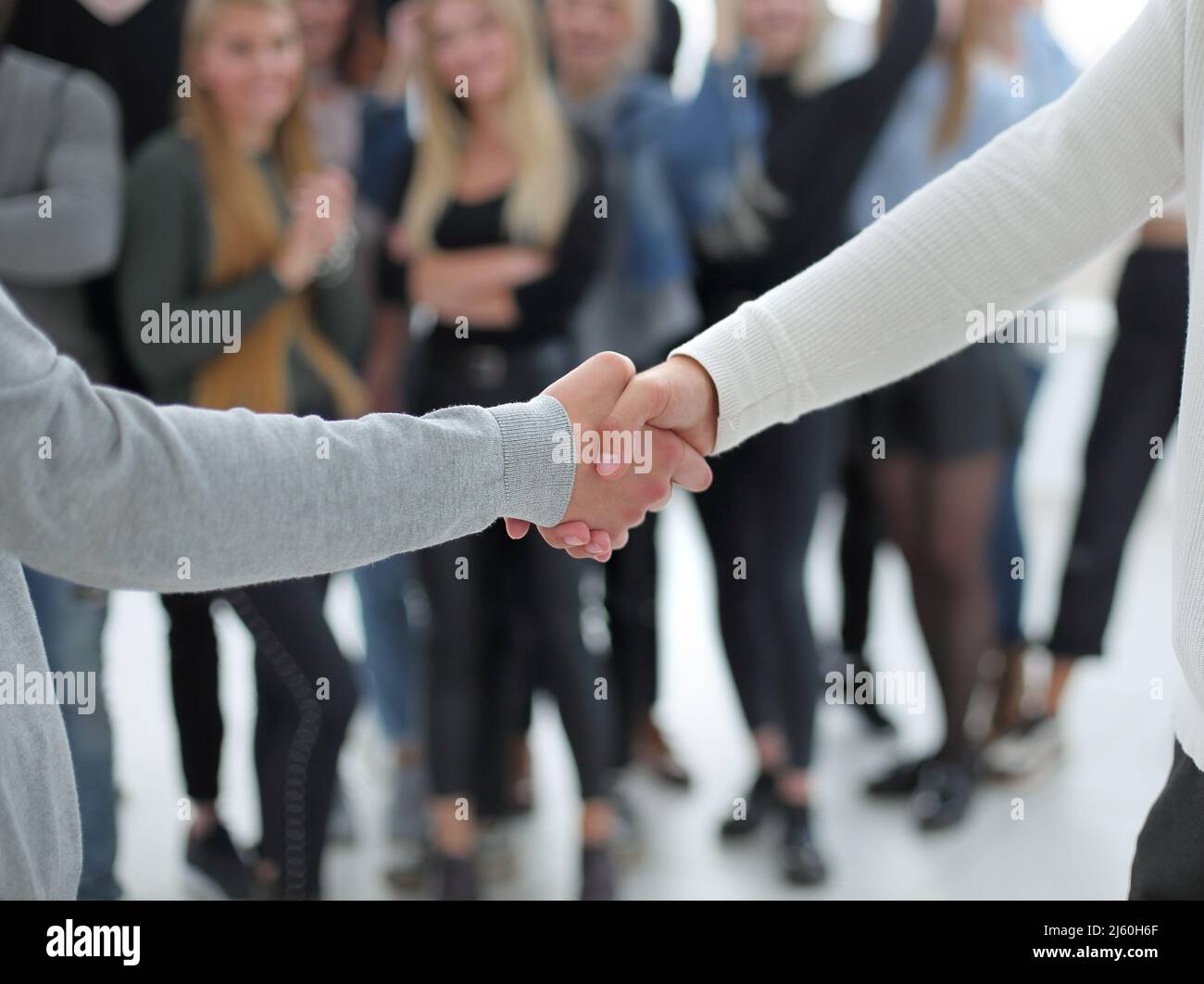 background image of diverse young people shaking hands Stock Photo - Alamy