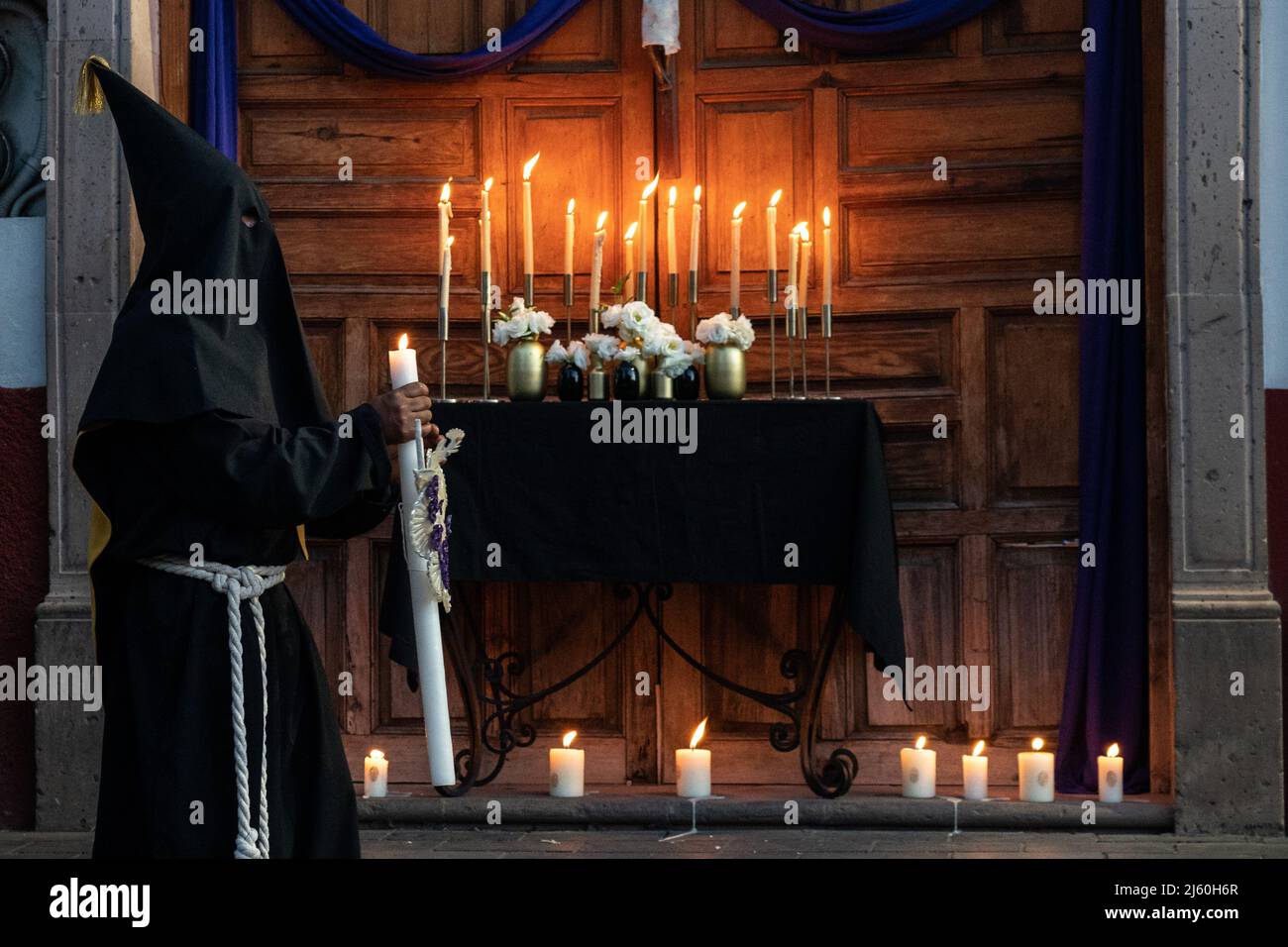 Roman Catholic hooded penitents wearing traditional capirotes, during a ...