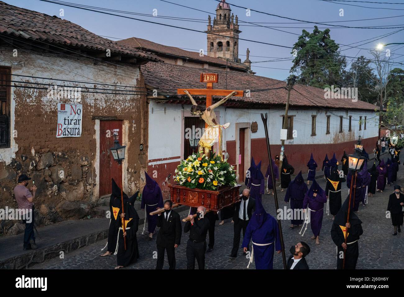 Roman Catholic hooded penitents wearing traditional capirotes, carry a ...