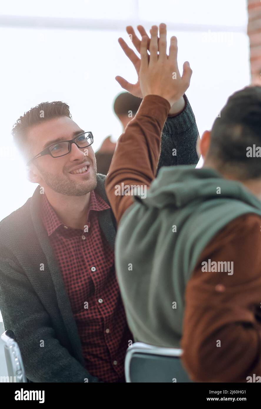 business colleagues giving each other high five Stock Photo - Alamy