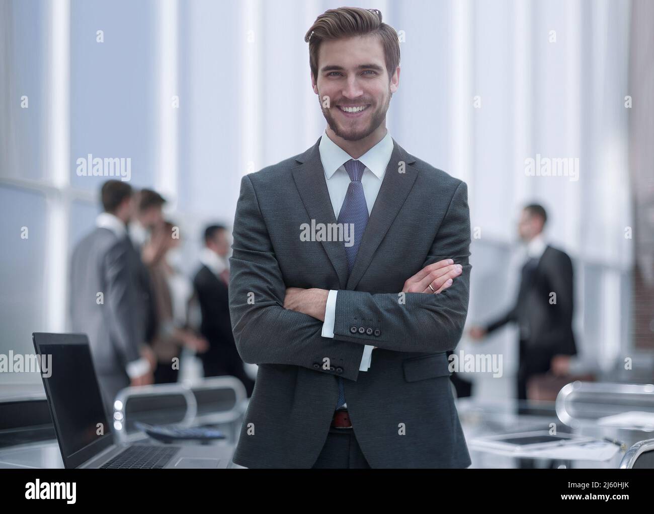 Successful businessman at the office leading a group Stock Photo - Alamy