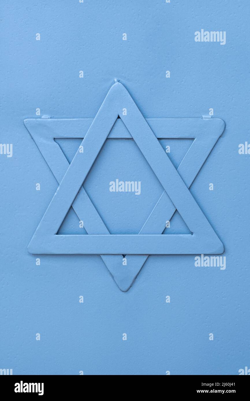 Metal Star of David (Magen David) Jewish symbol at blue fence metal ...