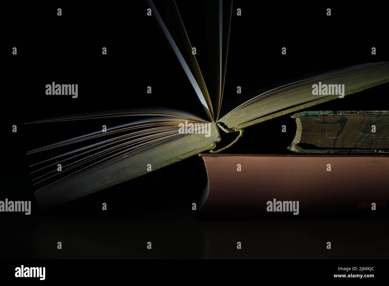 Open book, hardback book on dark background. Back to school,education ...