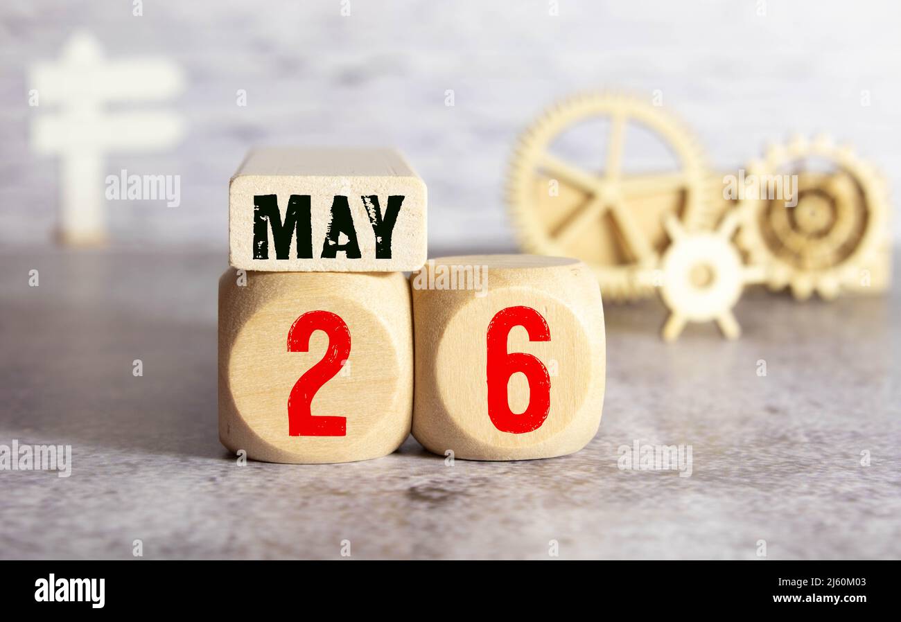 May 26th. May 26 wooden cube calendar with blur objects on background ...