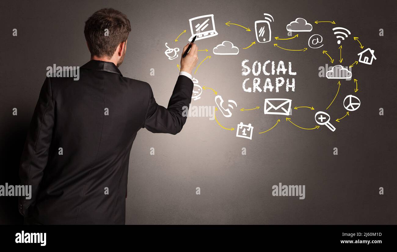 businessman drawing social media icons Stock Photo - Alamy