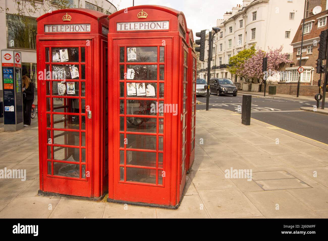 A group of four red Telephone boxes Stock Photo - Alamy