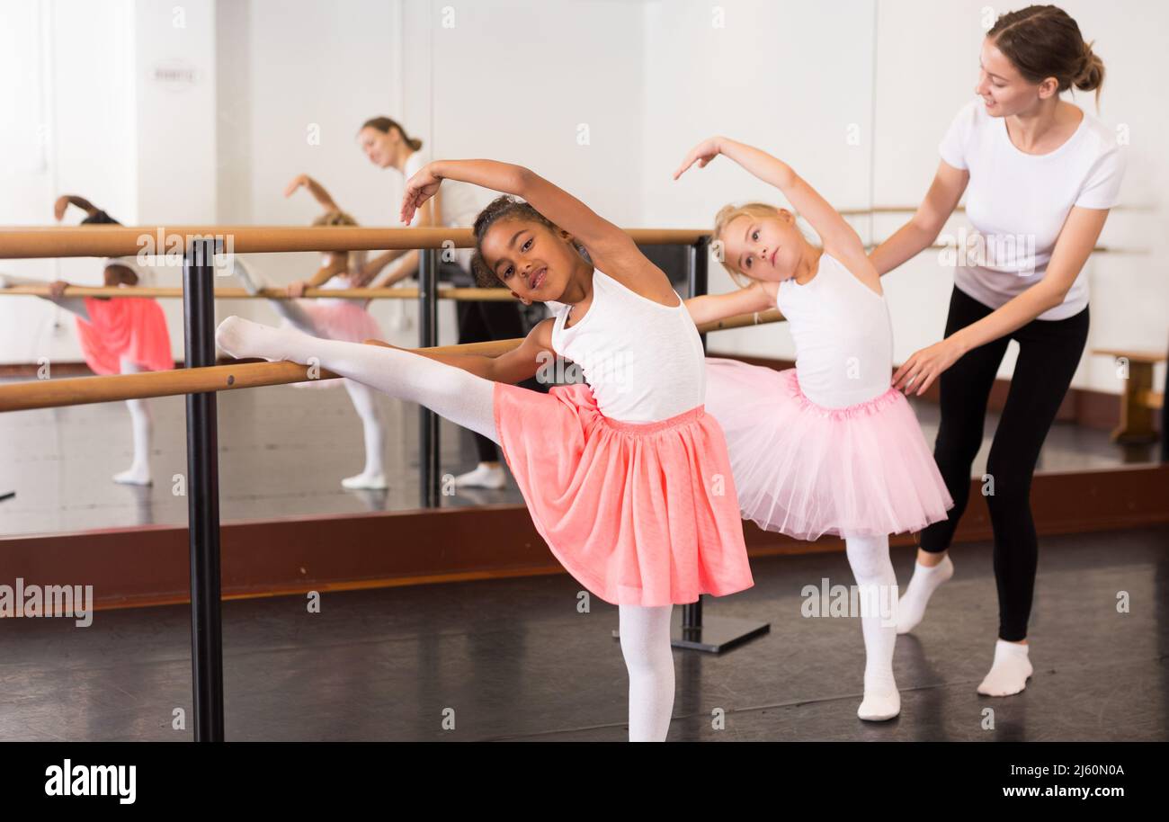 Ballet trainer teaching two little girls Stock Photo - Alamy