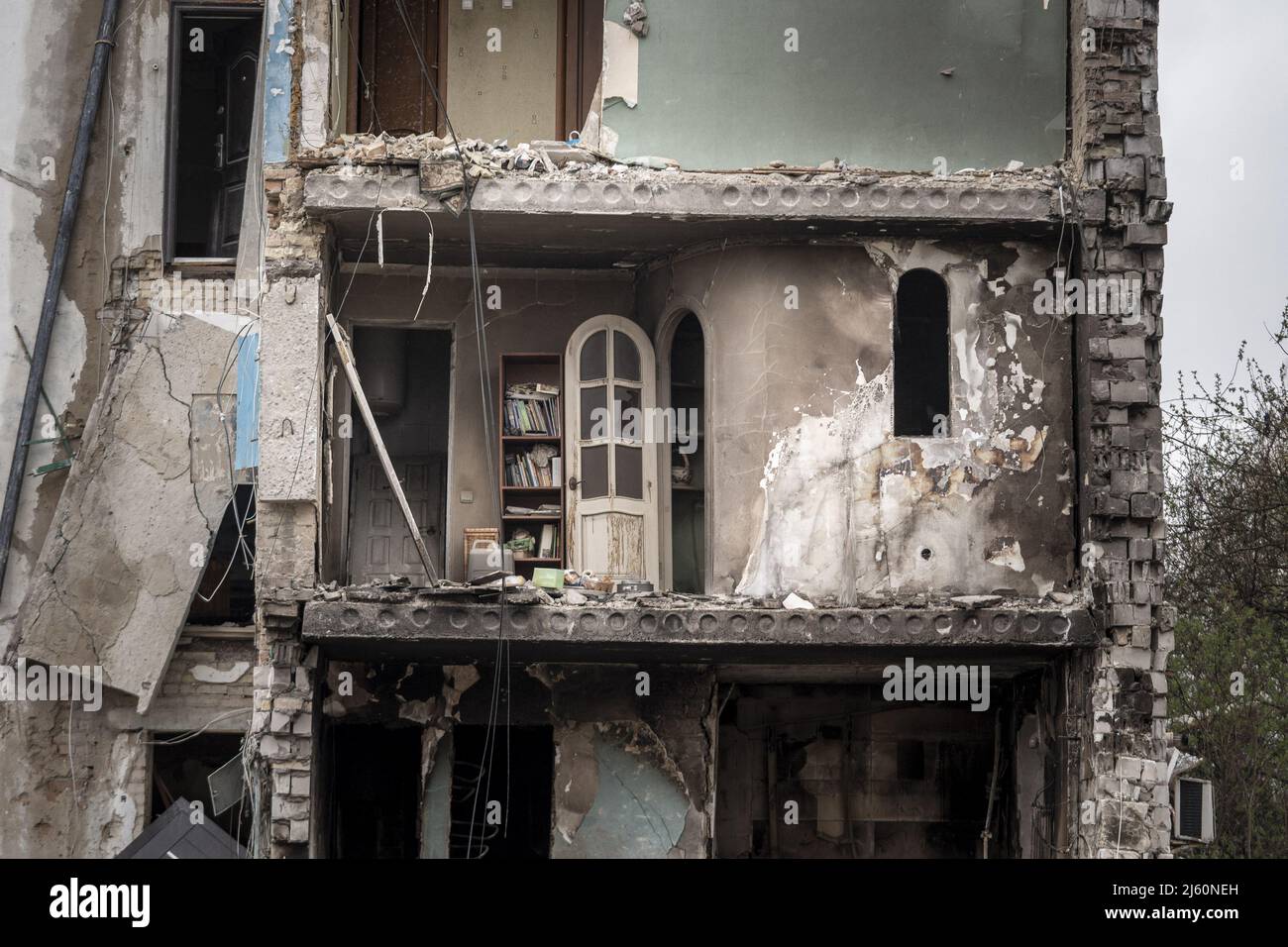 Borodyanka, Ukraine. 26th Apr, 2022. A bookcase remains standing in a ...