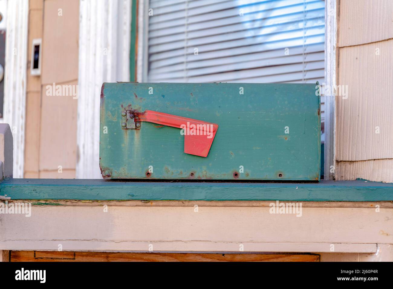 Old dark green mailbox on a green wooden surface at San Francisco ...