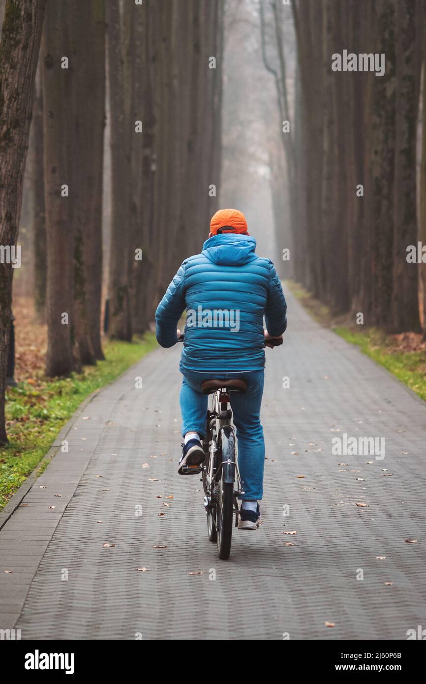 Person red bicycle rear view hi-res stock photography and images - Alamy
