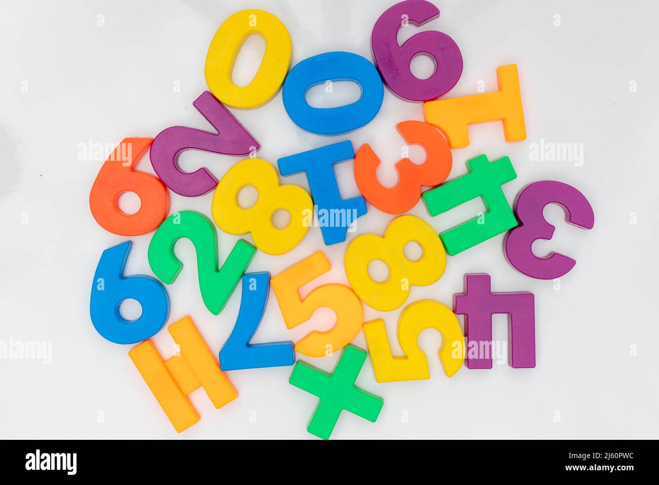 Colorful plastic numbers on a white isolated background Stock Photo - Alamy