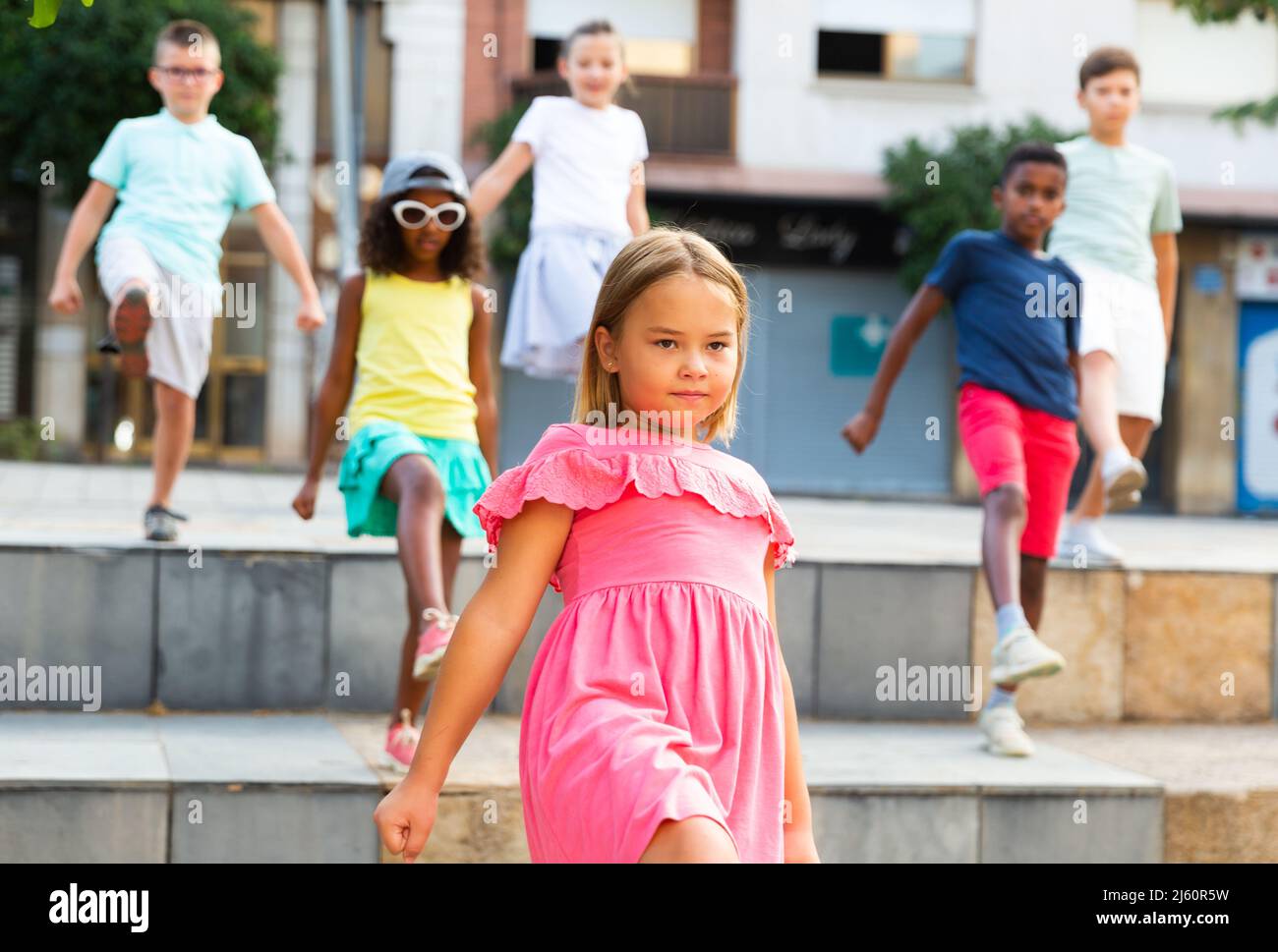 Group of kids performing street dance outdoors Stock Photo - Alamy