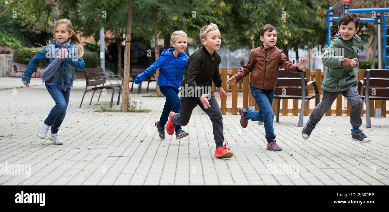Children running on playground Stock Photo - Alamy