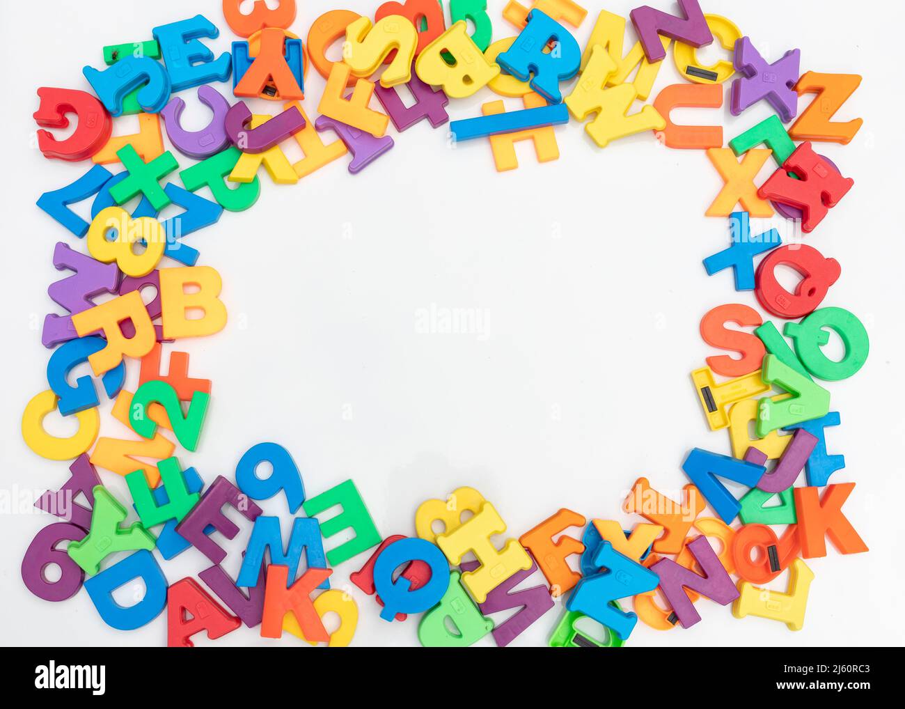 Plastic alphabet letters on an isolated white background with text ...