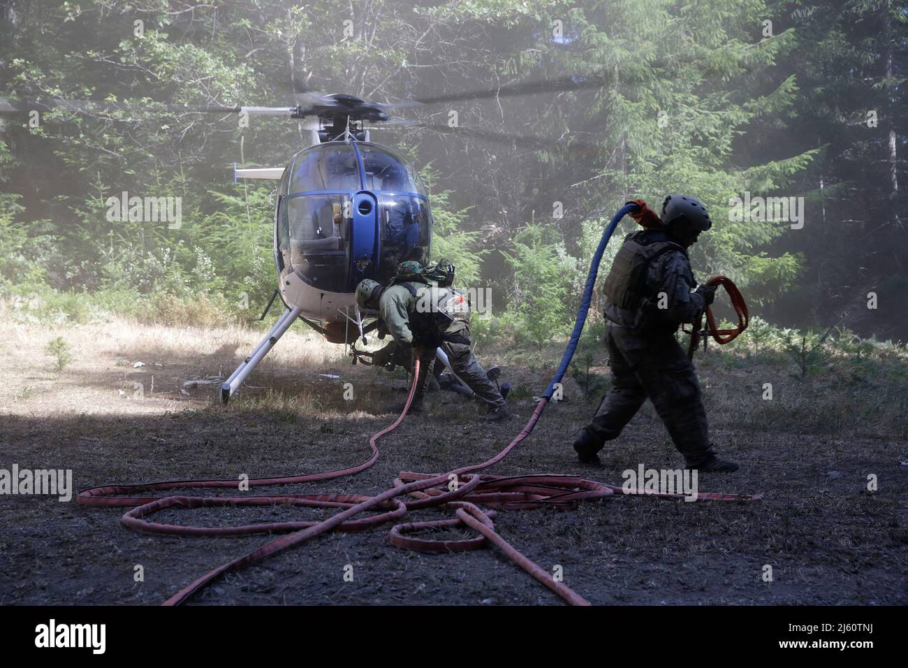 Police refuelling during an anti-marijuana raid Stock Photo - Alamy
