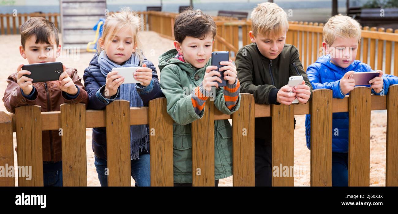 Kids with phone Stock Photo - Alamy