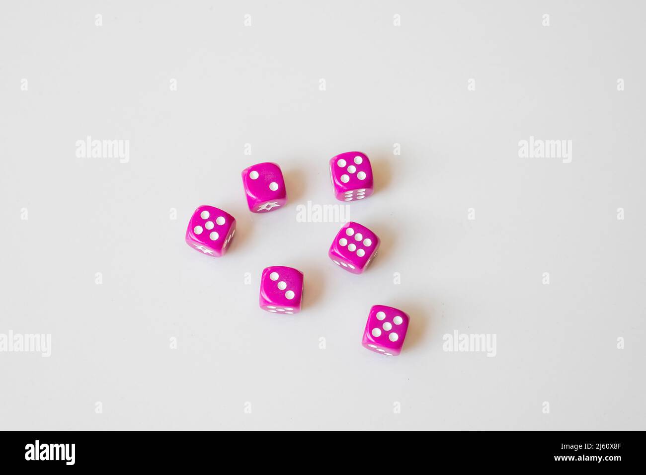 Concept of gambling and chance with dices on a white isolated ...