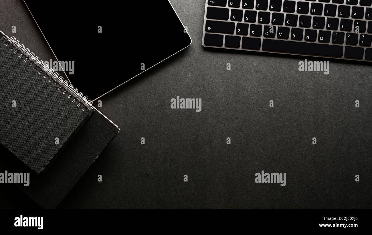 Top view, Modern hipster dark office workspace with keyboard computer ...