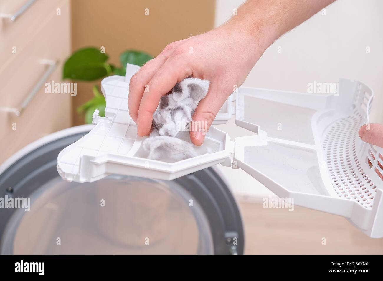 Remove clothes from dryer hi-res stock photography and images - Alamy