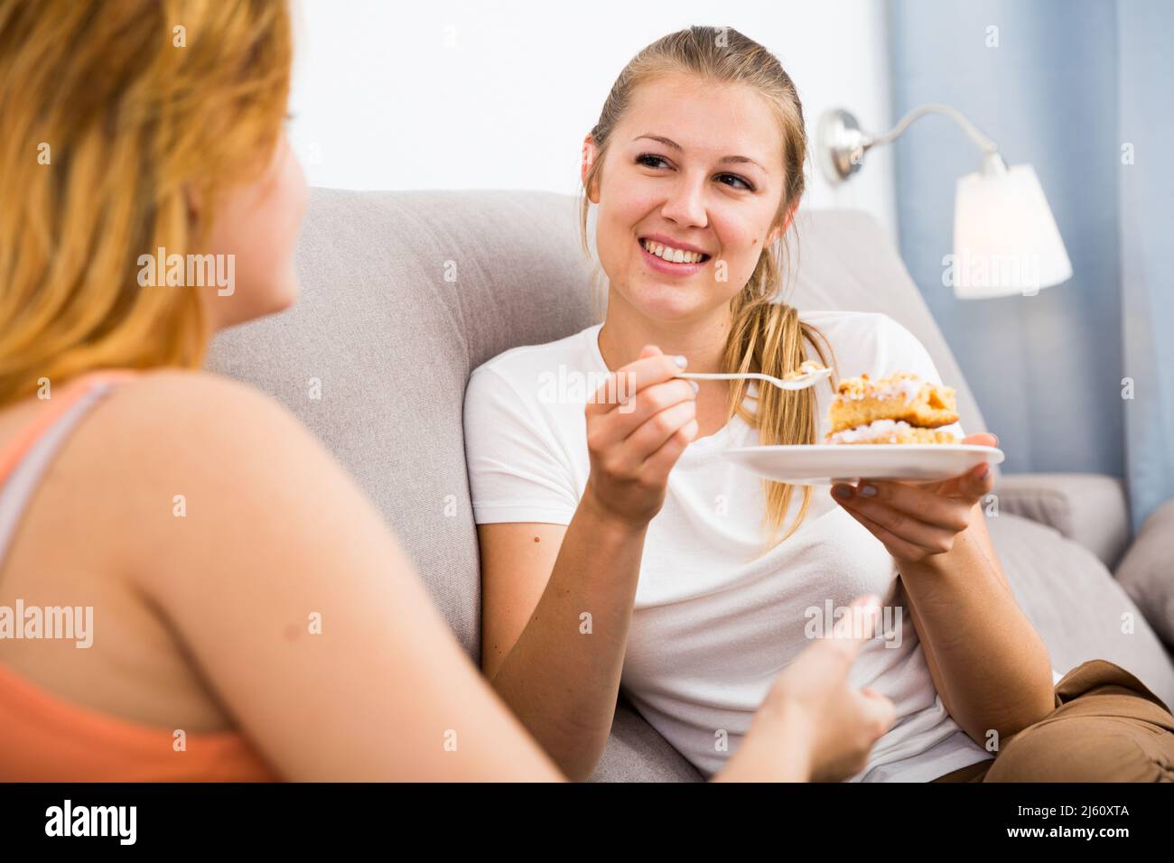 Portrait cheerful woman eating hi-res stock photography and images - Alamy