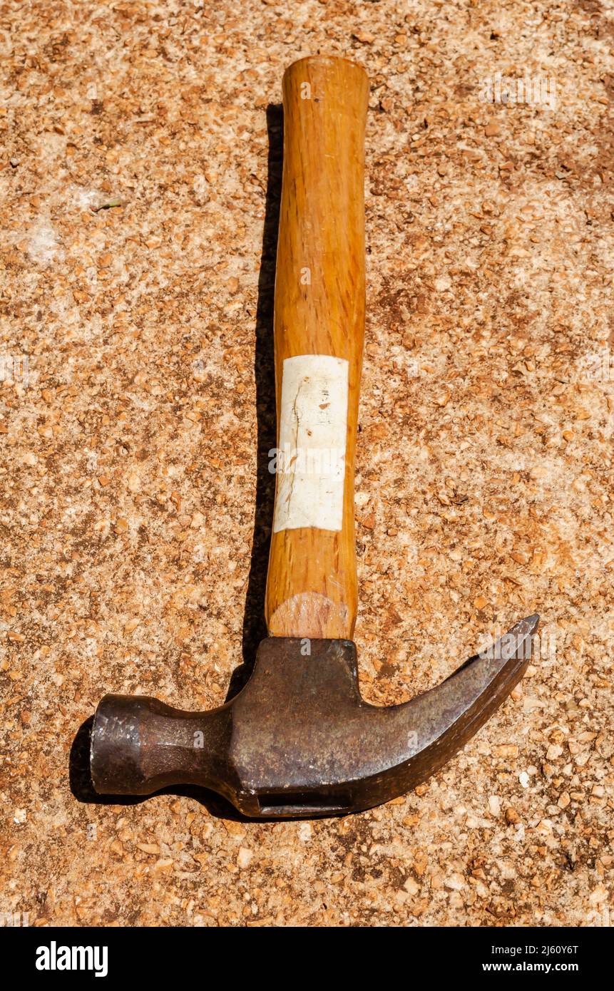 A hammer is left on the concrete pavement Stock Photo - Alamy