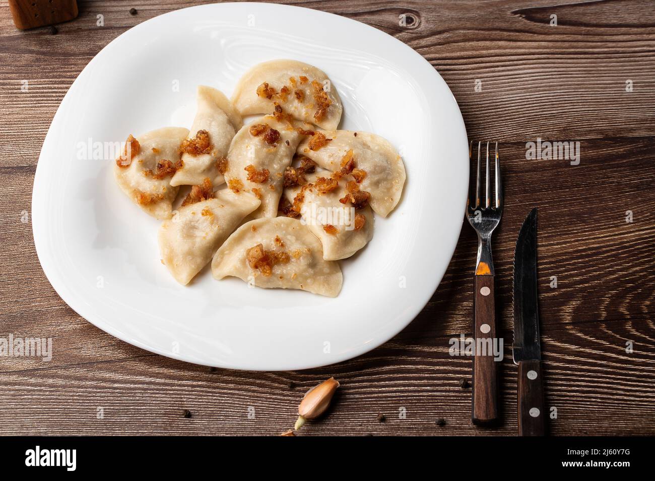 Traditional ukrainian dish vareniki served in a bowl with sour cream ...