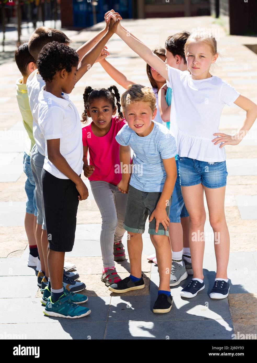 Energetic children play a game called trickle Stock Photo - Alamy