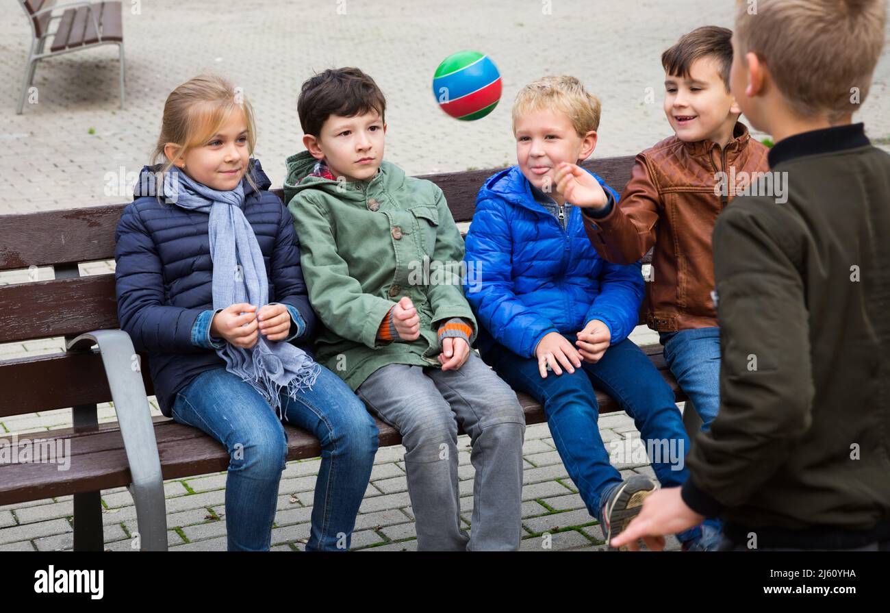 Children playing with small ball outdoor Stock Photo - Alamy