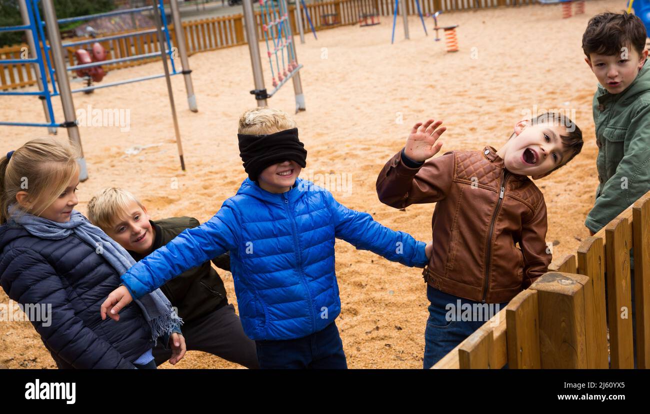 Children play in the blind man's buff Stock Photo - Alamy