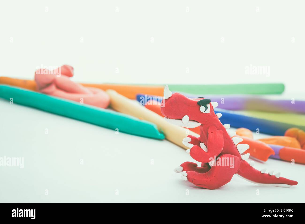 Beautiful play dough animal. Creative clay animal model. Red dinosaur ...