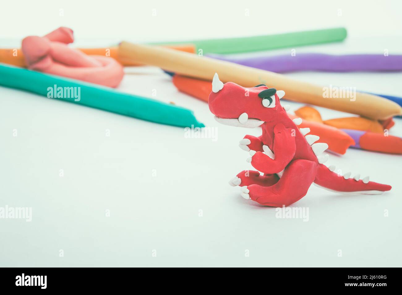 Beautiful play dough animal. Creative clay animal model. Red dinosaur ...