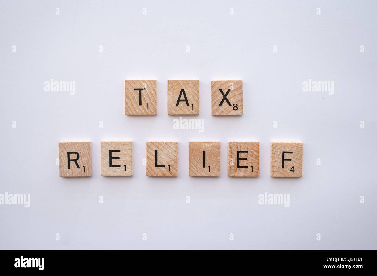 Tax relief concept on white background Stock Photo - Alamy