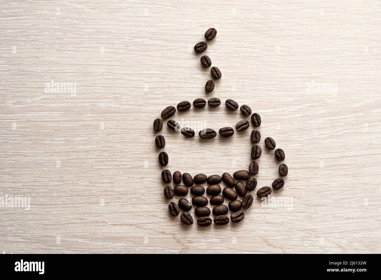 Coffee cup made from beans on white background. coffee bean close-up on ...