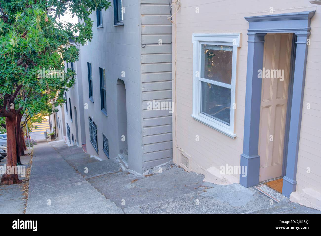 Steep sloped concrete side walk with steps in the middle in San ...
