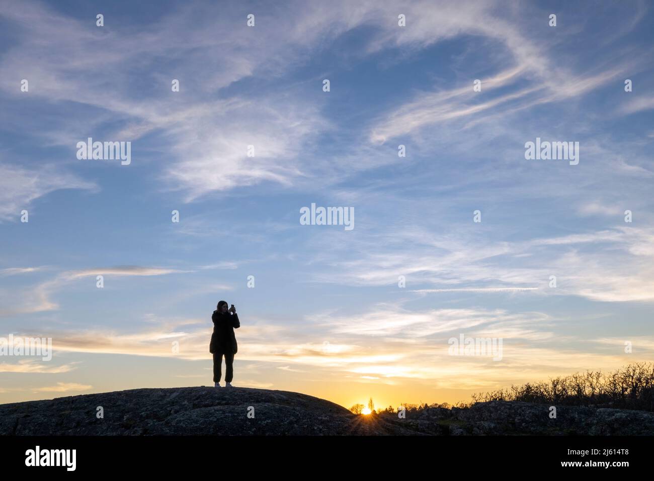 Person taking pictures of the sunset. Uplands Park in Oak Bay ...