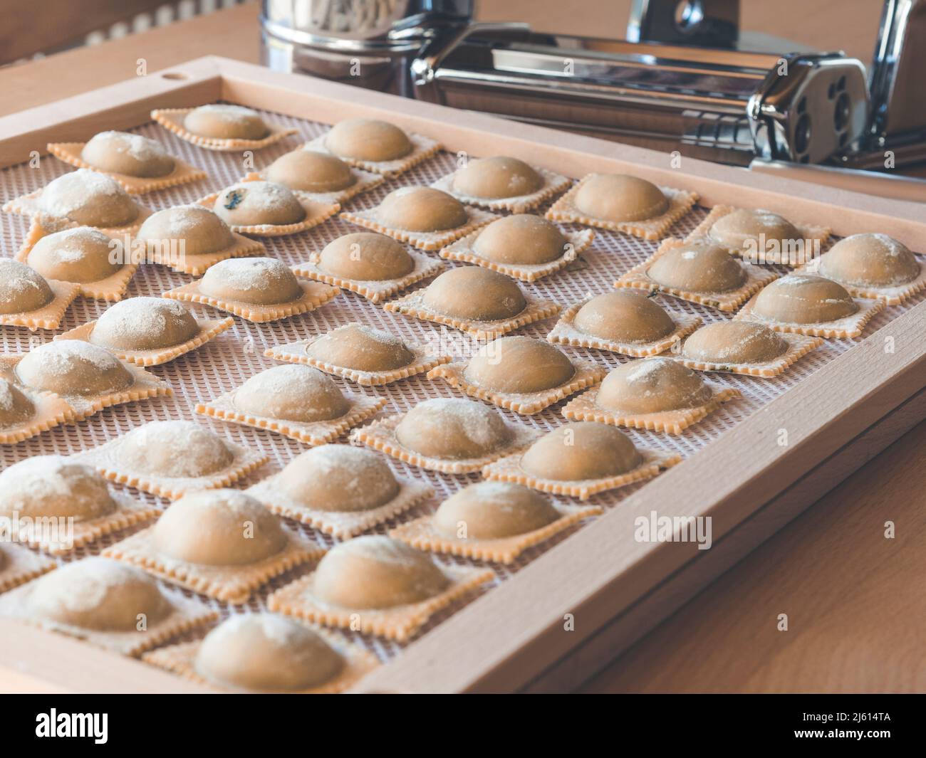 ravioli at wooden pasta dryer with noodle machine and equipment at the ...